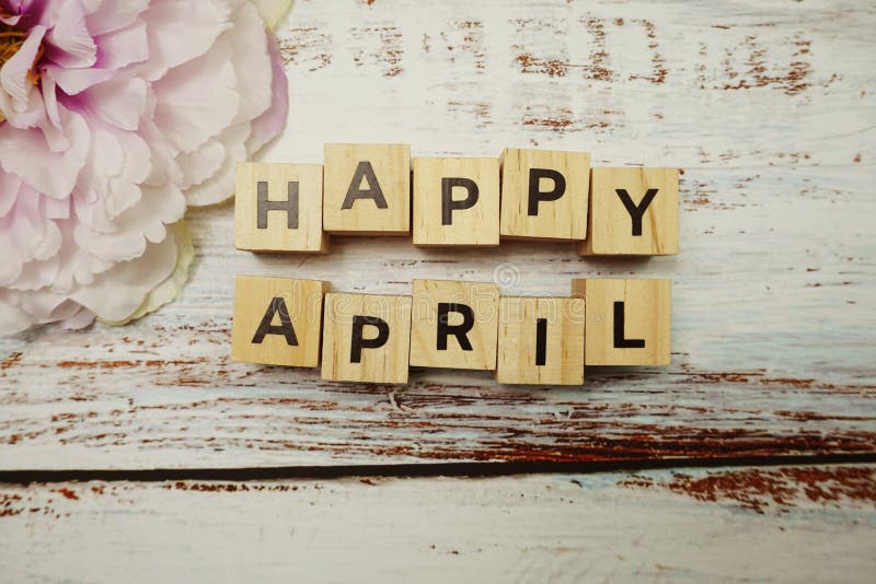 Happy April Alphabet Letters with Alarm Clock on Wooden Background ...