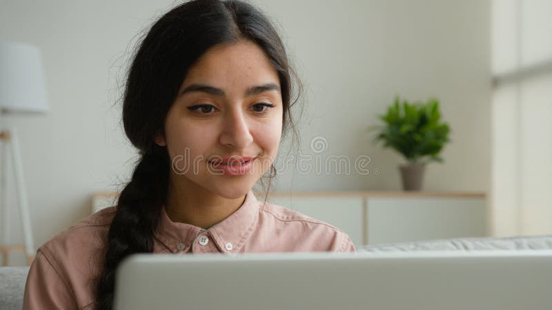 Happy Arabian Woman Student at Home Working with Computer Remote Education E-learning Write ...