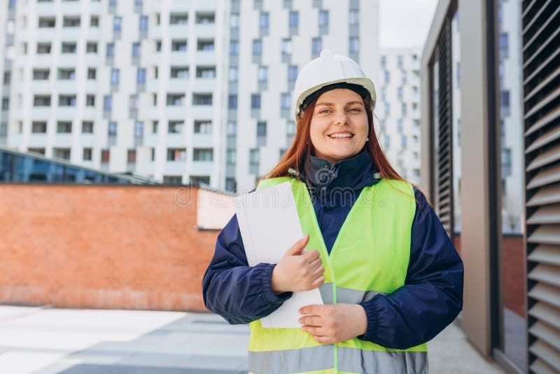 Happy Architect with Paper Folder with Documents at a Construction Site ...