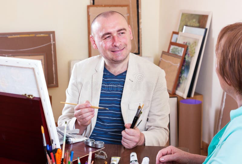 Happy artist draws stock photo. Image of painter, drawing - 58960704