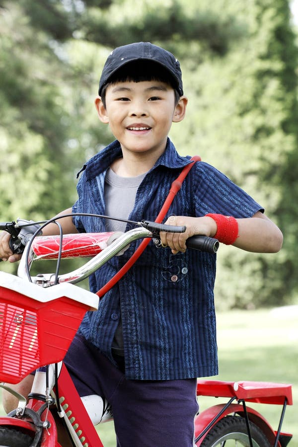 A happy Asian boy stock photo. Image of asia, color, cycling - 5343576