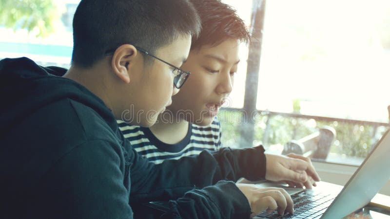 Happy Asian Boy Typing on Laptop Computer. Stock Image - Image of game ...