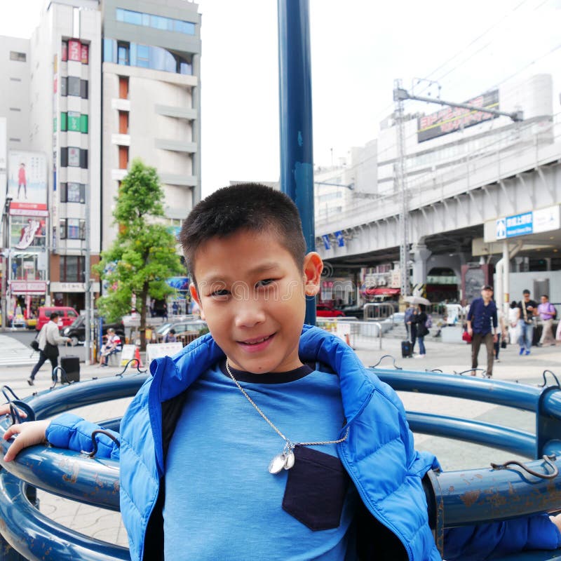 Happy Asian Boy Wearing Blue Down Jacket Stock Photos - Free & Royalty ...