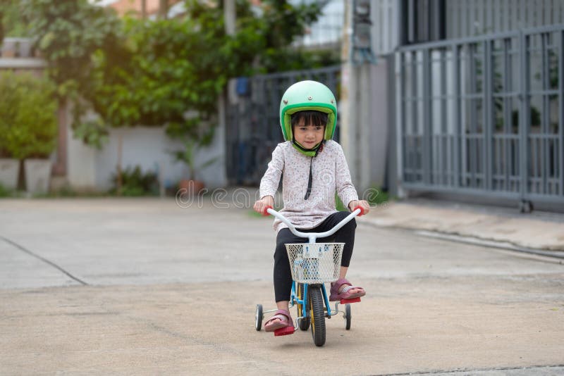 Happy Asian Child in Helmet Ride a Bicycle Stock Image - Image of child ...