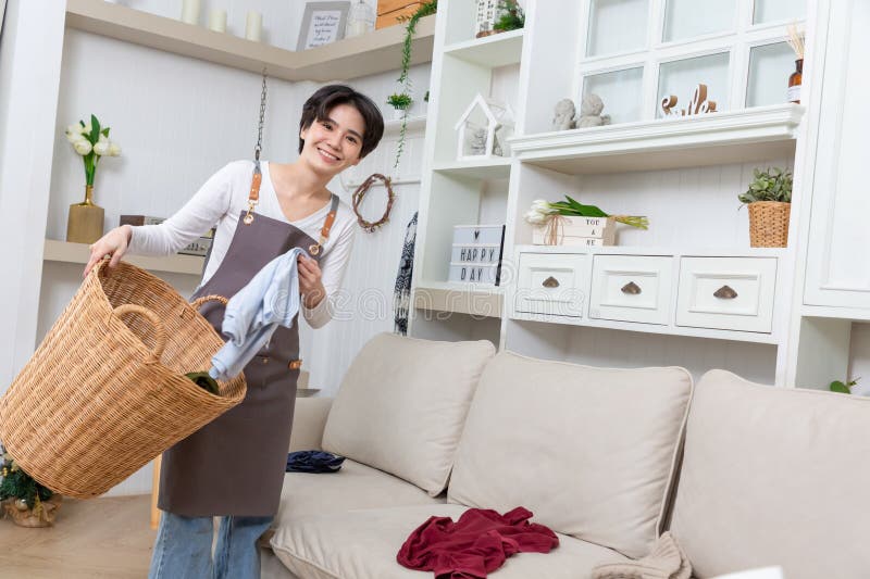 Happy Asian Cleaner Woman with Laundry Working at Home Stock Photo ...