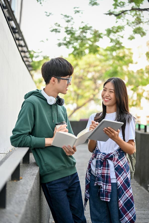 Happy Asian College Students Talking and Sharing Ideas on a School ...