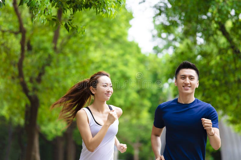 Happy Couple Jogging and Running in Nature Stock Image - Image of ...