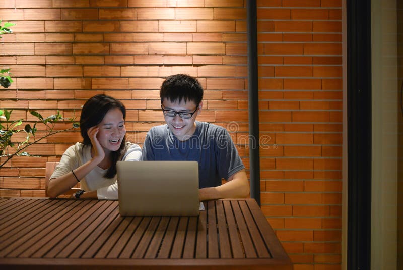 Happy Asian Couple are Working Together at Night Stock Image - Image of ...