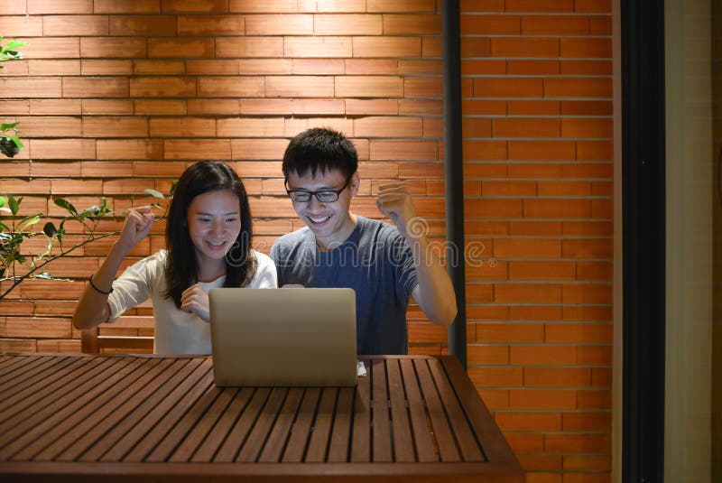 Happy Asian Couple are Working Together at Night Stock Photo - Image of ...