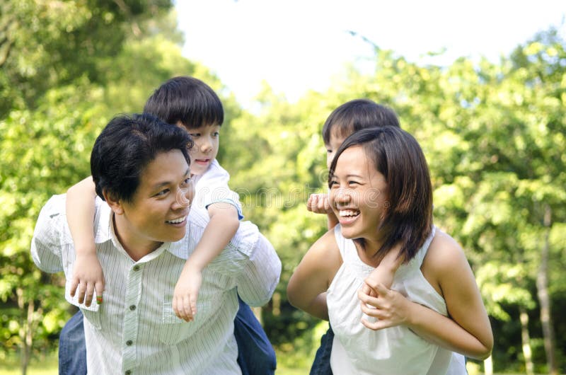 Happy Asian family stock image. Image of male, green - 23067459