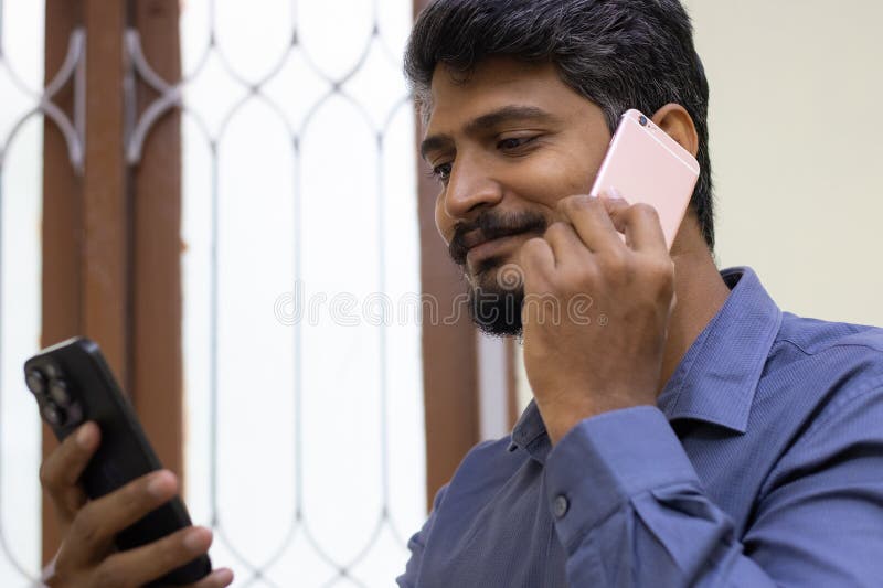 Happy Asian Indian Man Using Multiple Digital Devices, Smart Phone To ...
