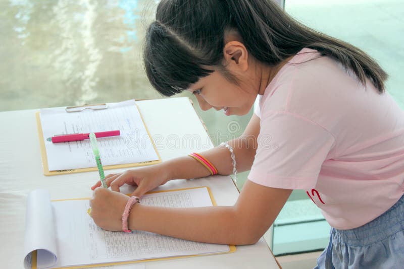 Happy Asian kid writing stock image. Image of face, asian - 94115233
