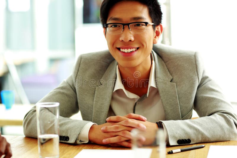 Happy Asian Man Sitting at the Table Stock Image - Image of business ...