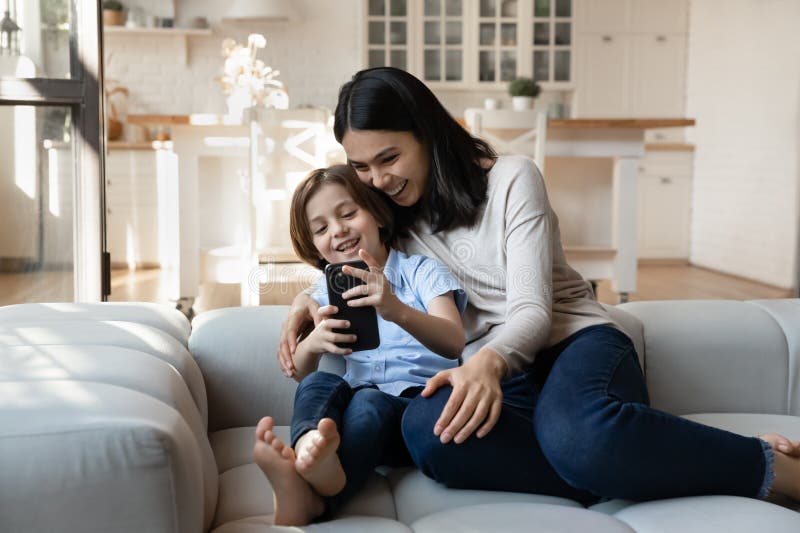 Happy Asian Mother with Little Son Using Phone Together Stock Photo ...
