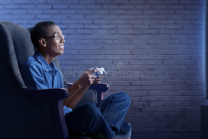 Happy Asian Nerd Man in Sofa with Gamepad Playing Game Stock Photo ...