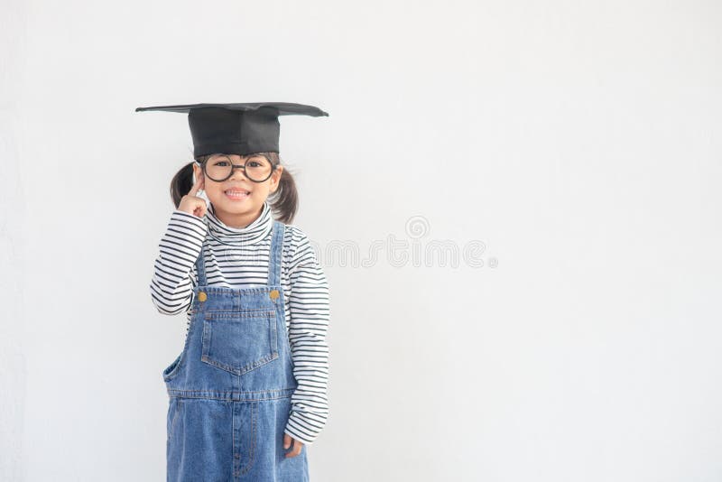 Happy Asian School Kid Graduate Thinking with Graduation Cap Stock ...