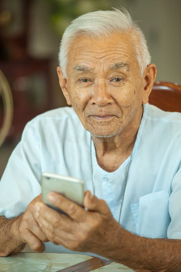 Happy Asian Senior Man Using the Mobile Phone Stock Image - Image of ...