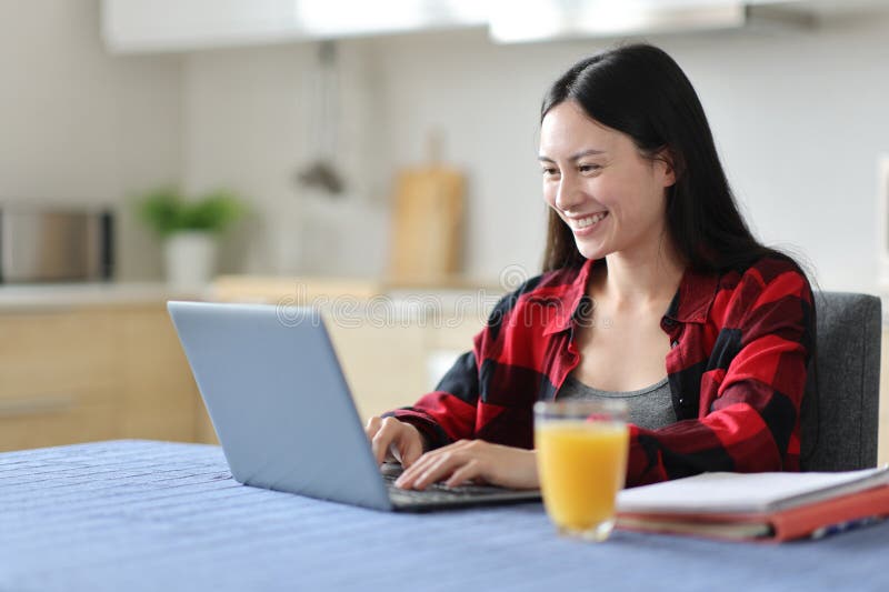 Happy Asian Student Writing on Laptop at Breakfast Stock Image - Image ...