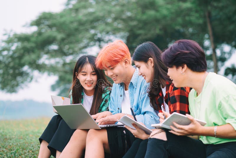 Happy Asian Students are Doing Homework Together at the Park Stock ...