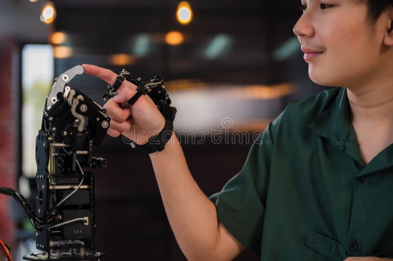 Happy Asian Teenage Boy Student Learning Technology Testing Hand and ...