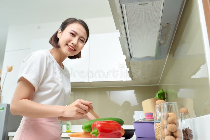 Happy Asian Woman Cooking in the Kitchen Stock Image - Image of ...