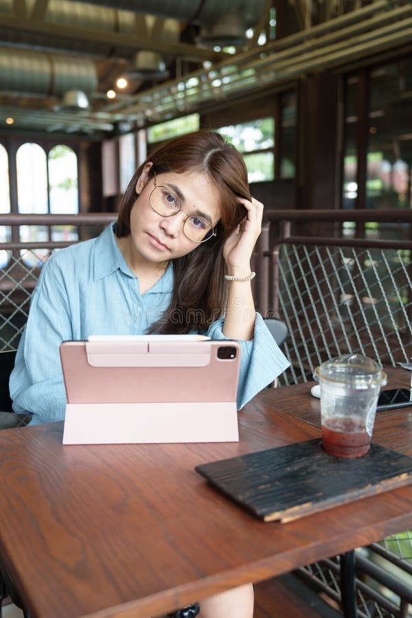 Happy Asian Woman Using Computer Tablet at Coffee Cafe Stock Image ...