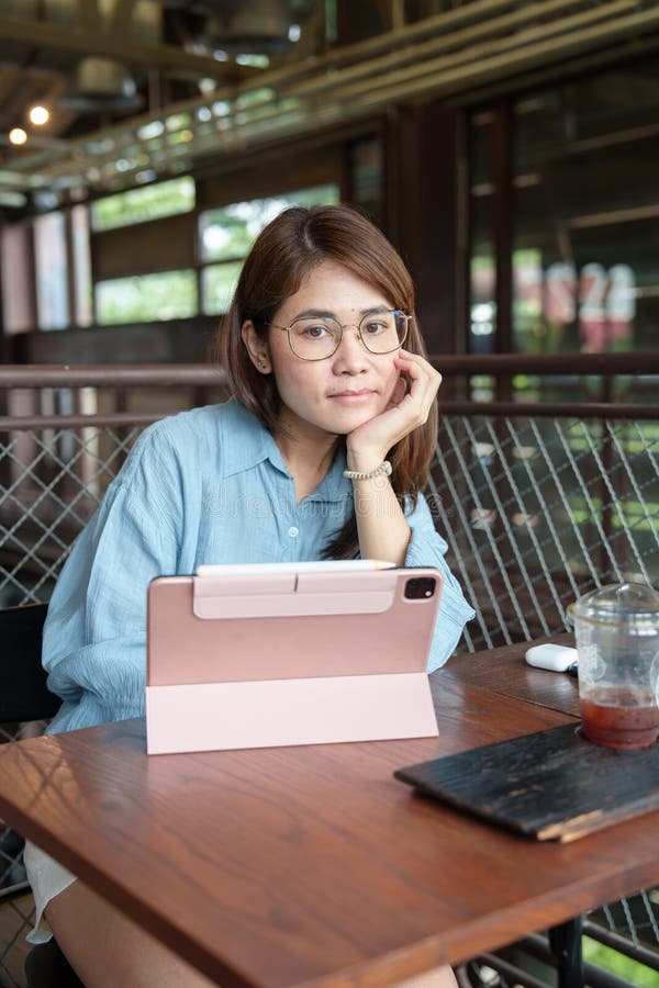 Happy Asian Woman Using Computer Tablet at Coffee Cafe Stock Image ...