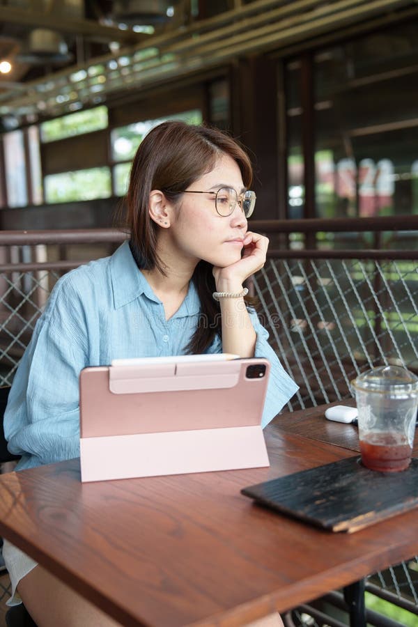 Happy Asian Woman Using Computer Tablet at Coffee Cafe Stock Photo ...