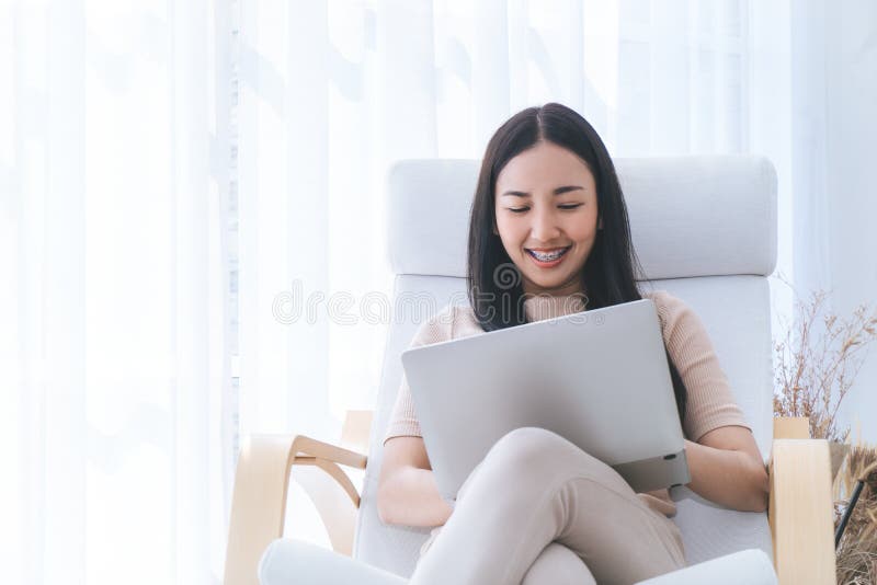 Happy Woman Using Laptop Computer on Sofa Stock Image - Image of female ...