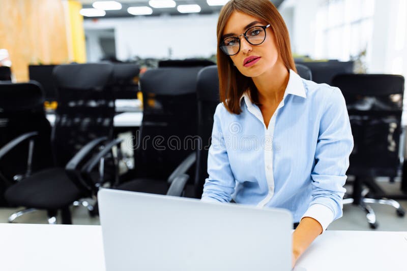 Happy Attractive Business Woman Using Laptop while Sitting at Work ...