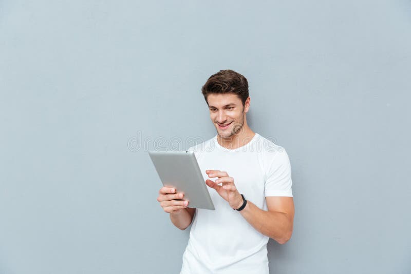 Young man using tablet stock image. Image of camera, email - 31030227
