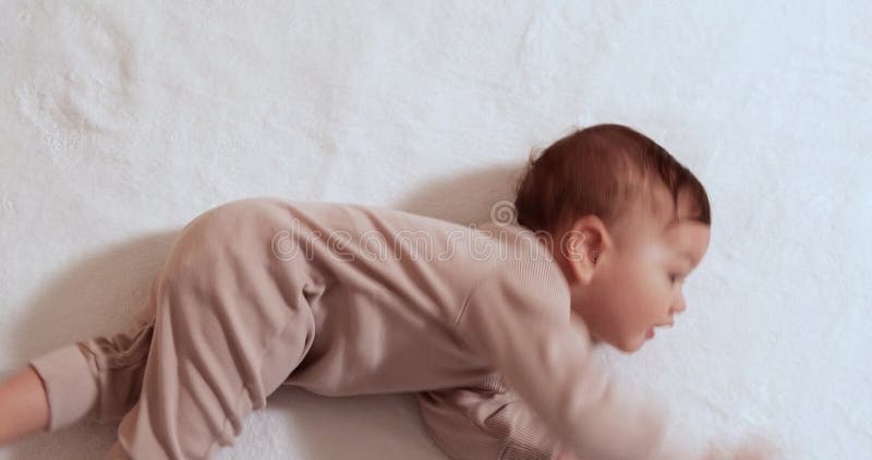 Happy Baby Boy Lying Roll Over in Bed Stock Video - Video of bedroom ...