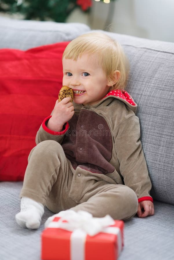 Happy Baby Eating Christmas Cookie Stock Image - Image of biscuit ...