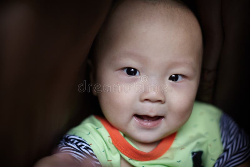 Happy baby face closeup stock image. Image of leaf, dark - 44043545