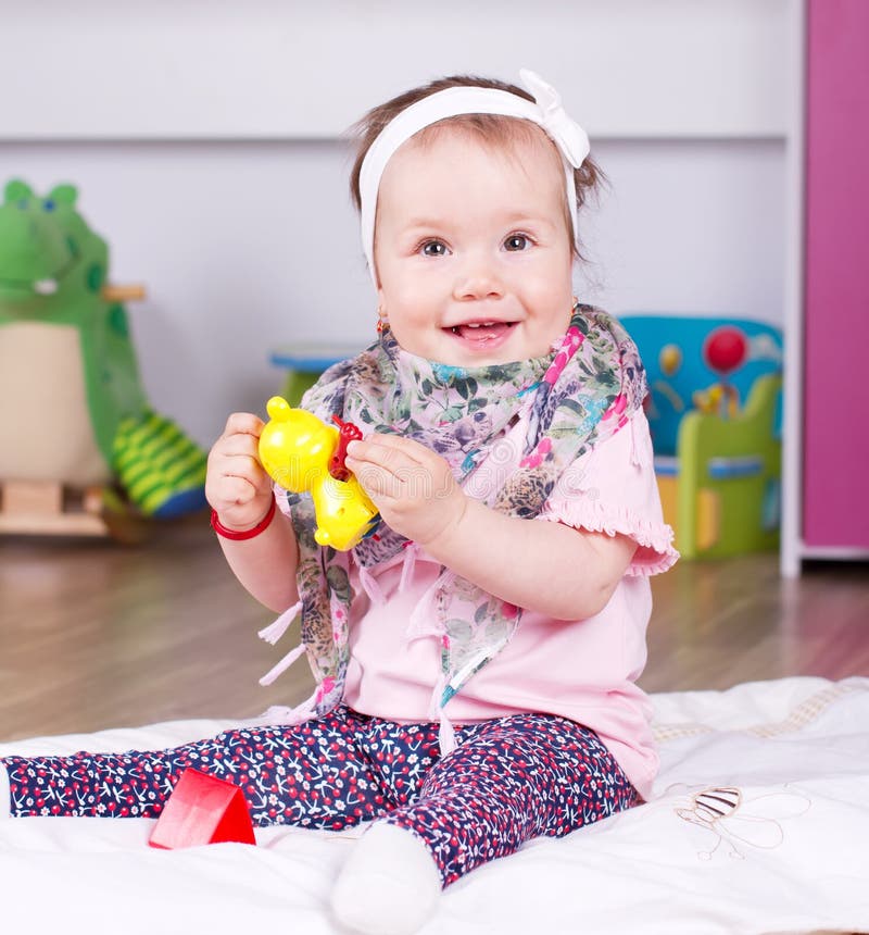 Happy baby girl playing stock image. Image of dressed - 38654031