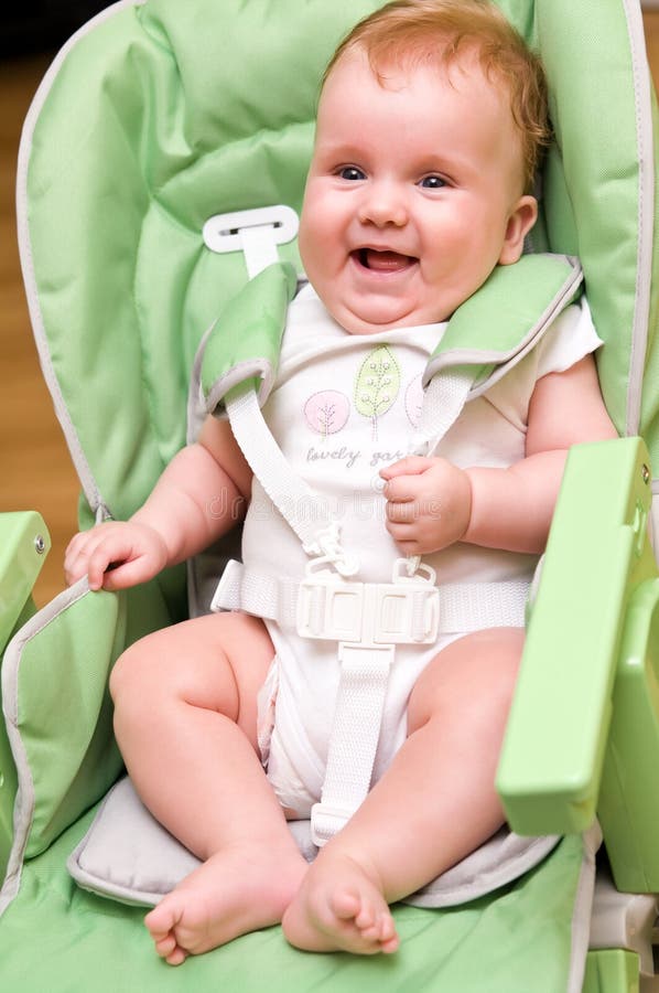 Happy baby in high chair stock image. Image of happy - 15676235