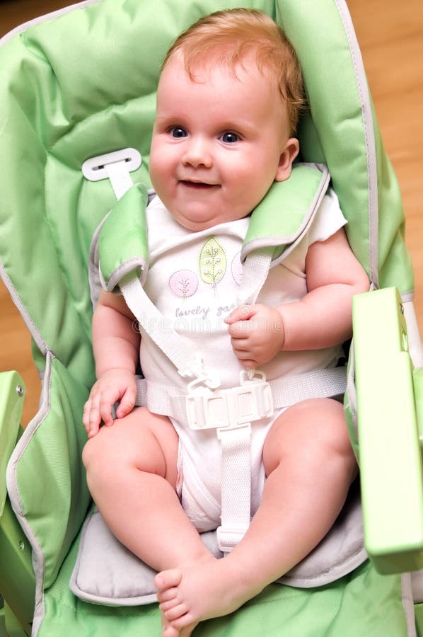 Happy baby in high chair stock photo. Image of joyfully - 15676250