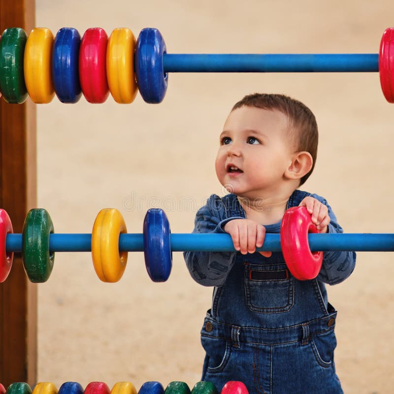 Happy Baby Learning Math on Abacus while Playing on Playground Stock ...