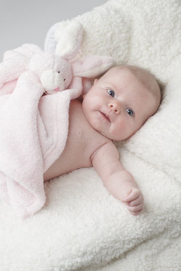 Happy Baby with Pink Toy Bunny Blanket Stock Image - Image of eyes ...