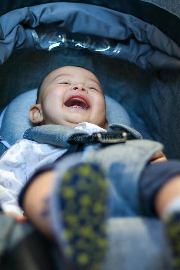 Happy Baby Sitting in Her Stroller Stock Image - Image of orange, cute ...