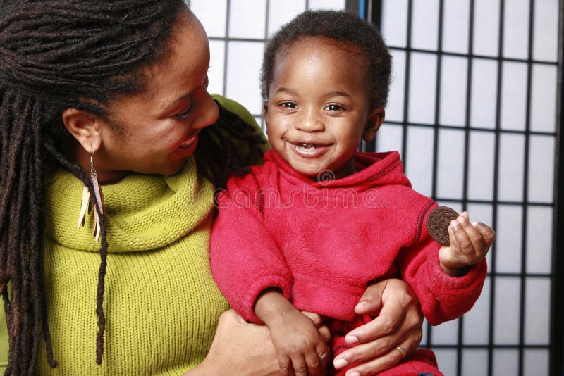 Baby Excitedly Eating a Cookie Stock Image - Image of mommy, mother: 392357