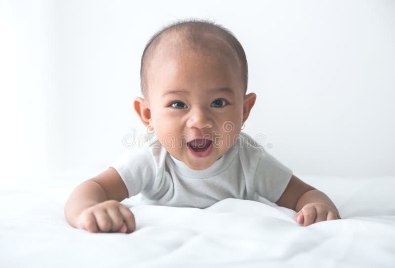 Happy baby tummy time stock image. Image of month, laying - 65870797