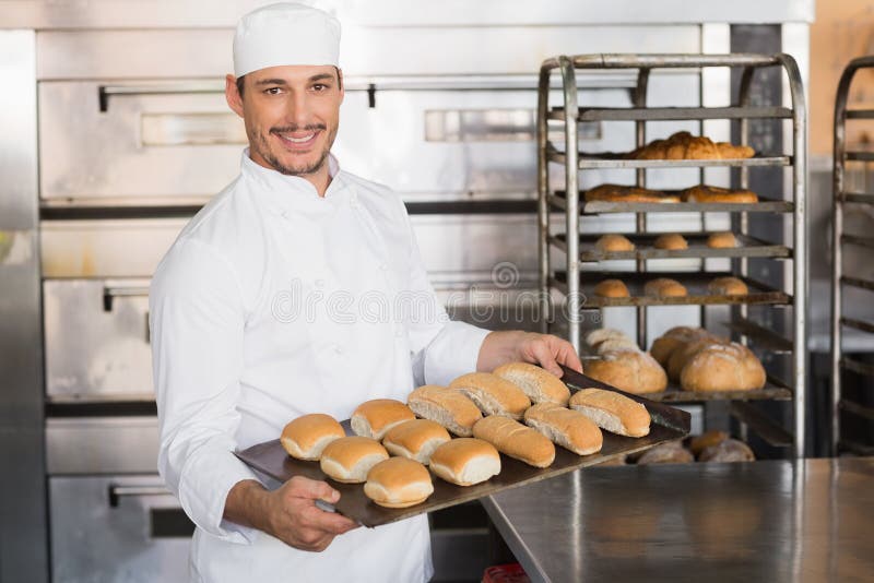 Happy Baker Showing Tray of Fresh Bread Stock Photo - Image of indoors ...
