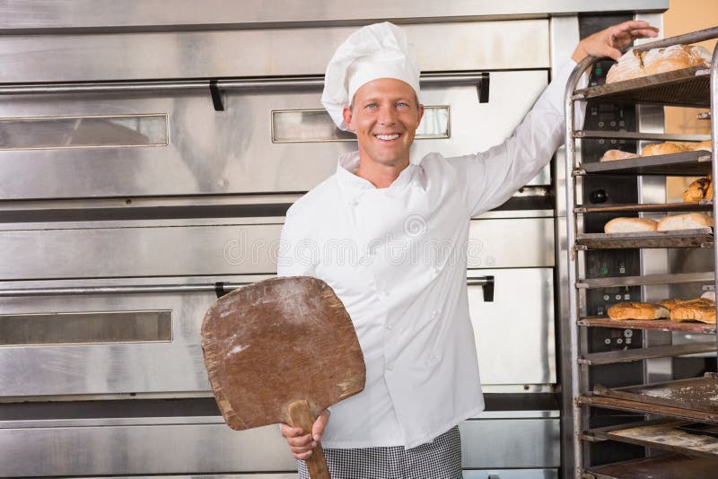 Happy Baker Smiling at Camera Stock Image - Image of baker, shelf: 49245543