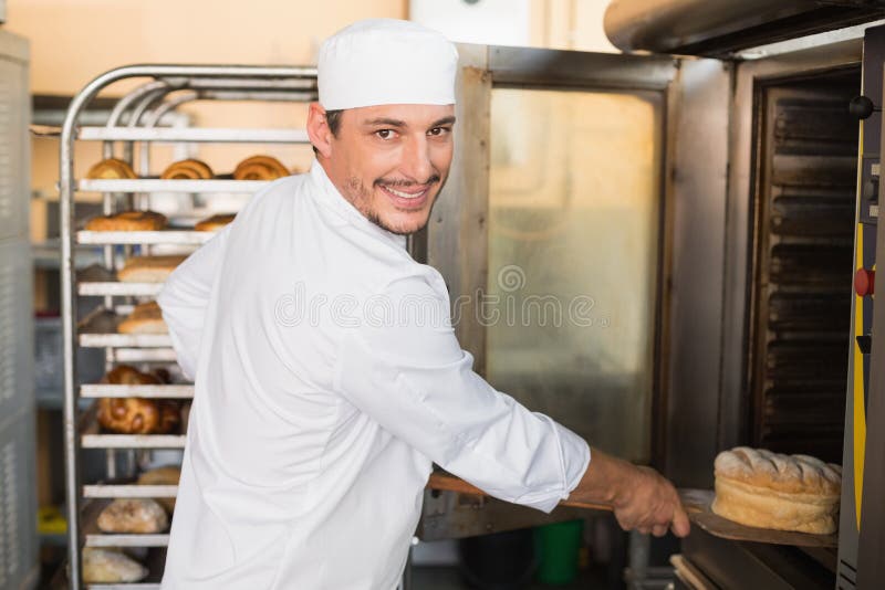 Happy Baker Taking Out Fresh Loaf Stock Photo - Image of adult ...