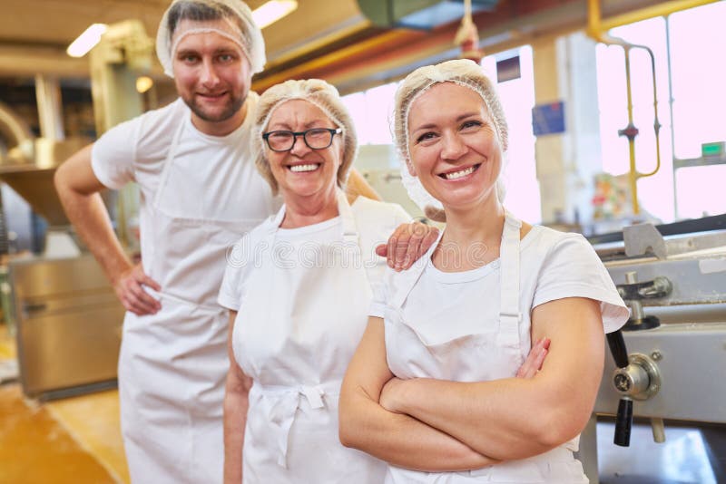 Happy Baker Team with Apprentices in Training Stock Photo - Image of ...