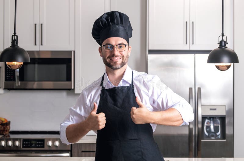 Happy Baker with Thumb Up. Handsome Man Chef in Uniform Cooking in the ...