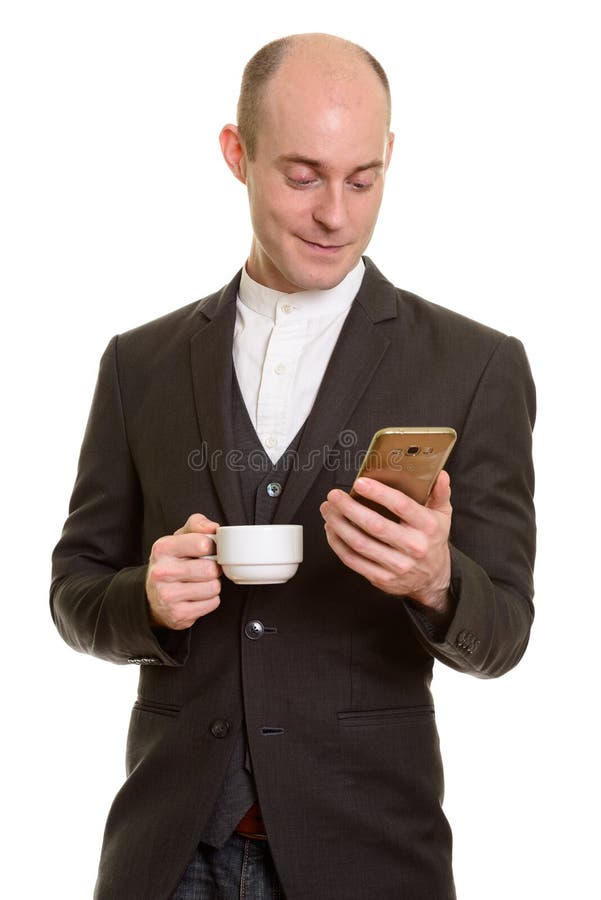 Happy Bald Caucasian Businessman Smiling While Holding Mobile Ph Stock