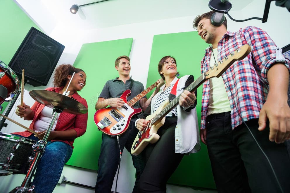 Happy Band Members Performing in Recording Studio Stock Image - Image ...