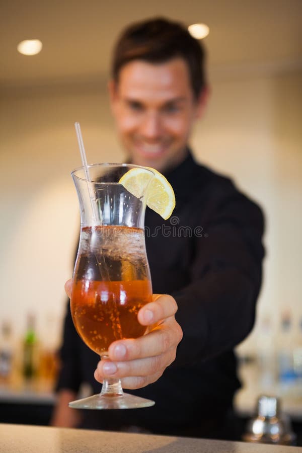 Happy Bartender Offering Cocktail To Camera Stock Image - Image of ...